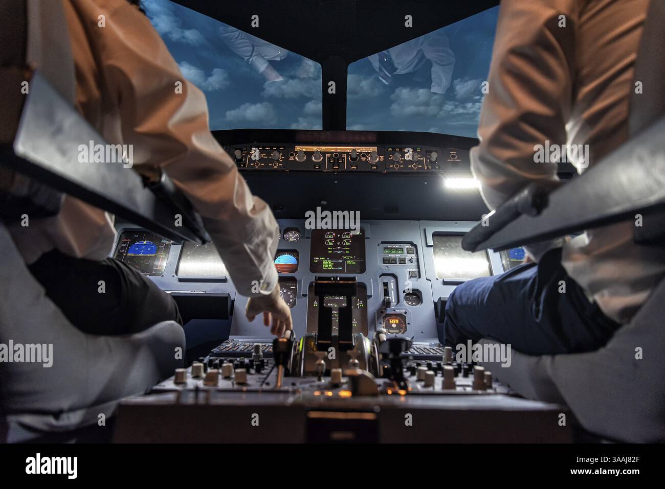 Pilots in the cockpit of an aircraft during a flight Stock Photo - Alamy