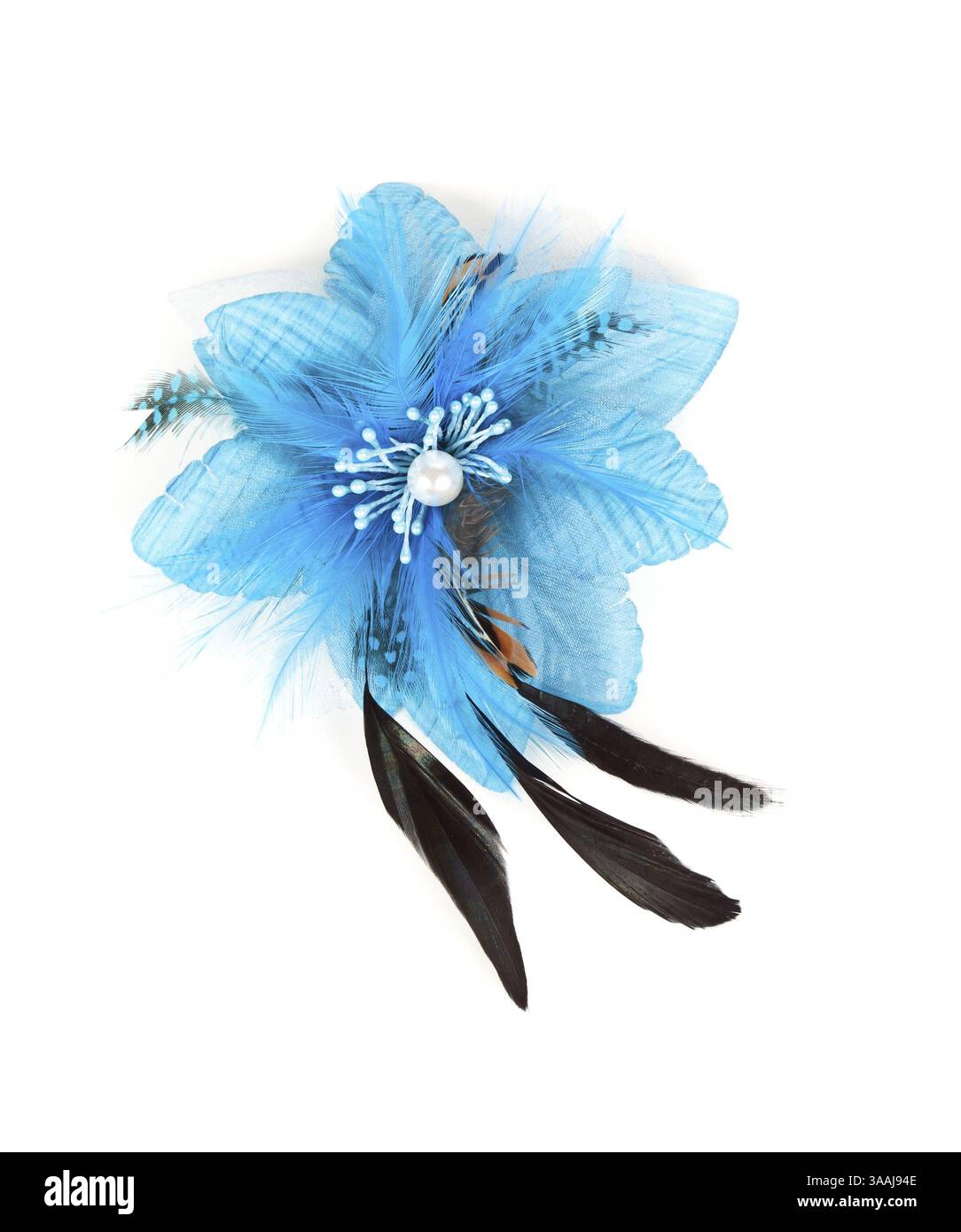 Blue flower fabric with feathers and a large pearl in the center Stock ...