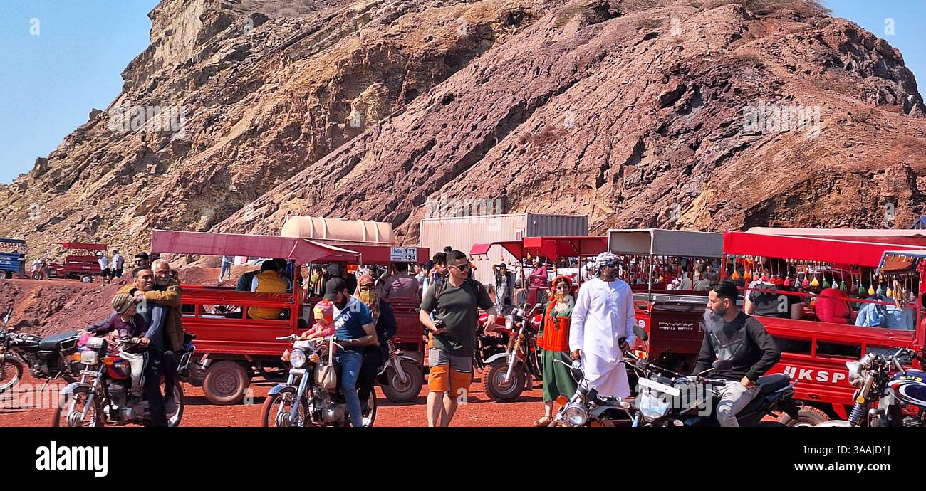 A vibrant panoramic view captures the unique red sands and geological ...