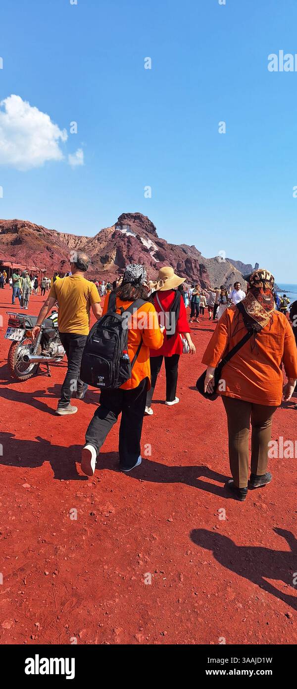 A vibrant panoramic view captures the unique red sands and geological ...