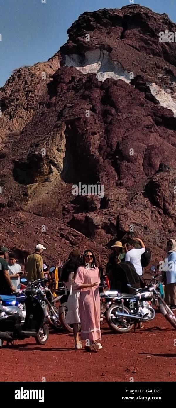 A vibrant panoramic view captures the unique red sands and geological ...