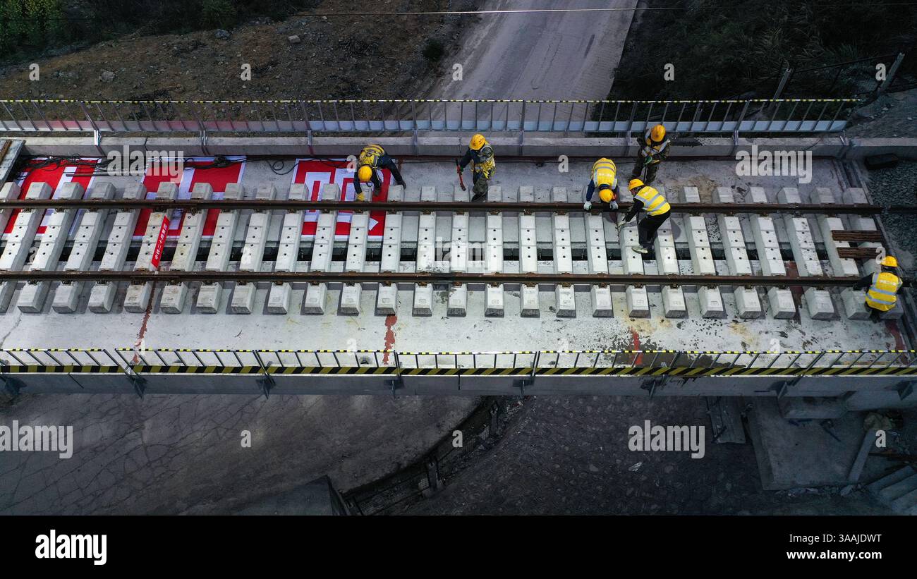 Fuquan. 31st Mar, 2025. An aerial drone photo shows workers laying ...