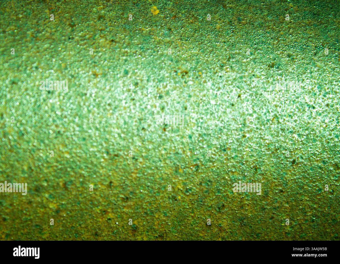 Corroded metal surface with green rust creating a textured background ...