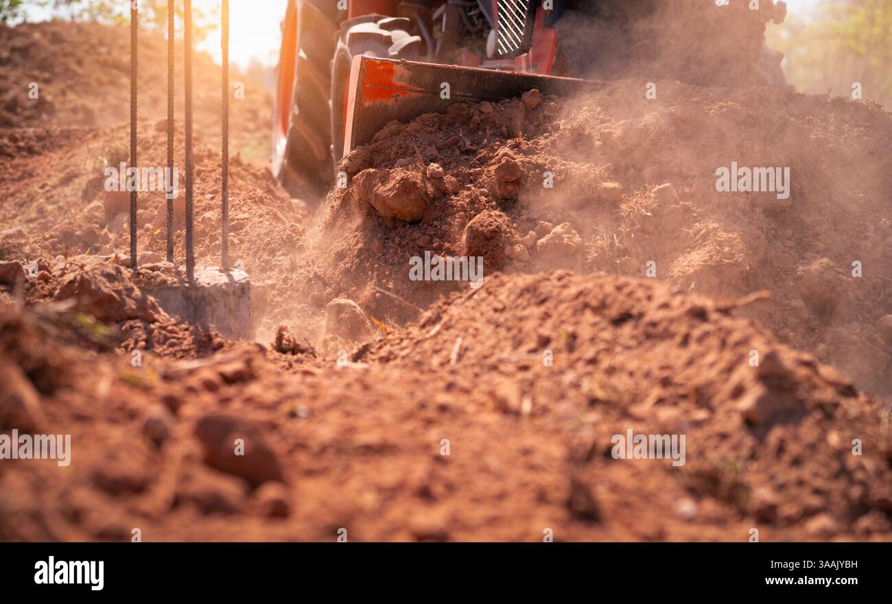 Construction tractor with specialized dozer blade pushing and grading ...