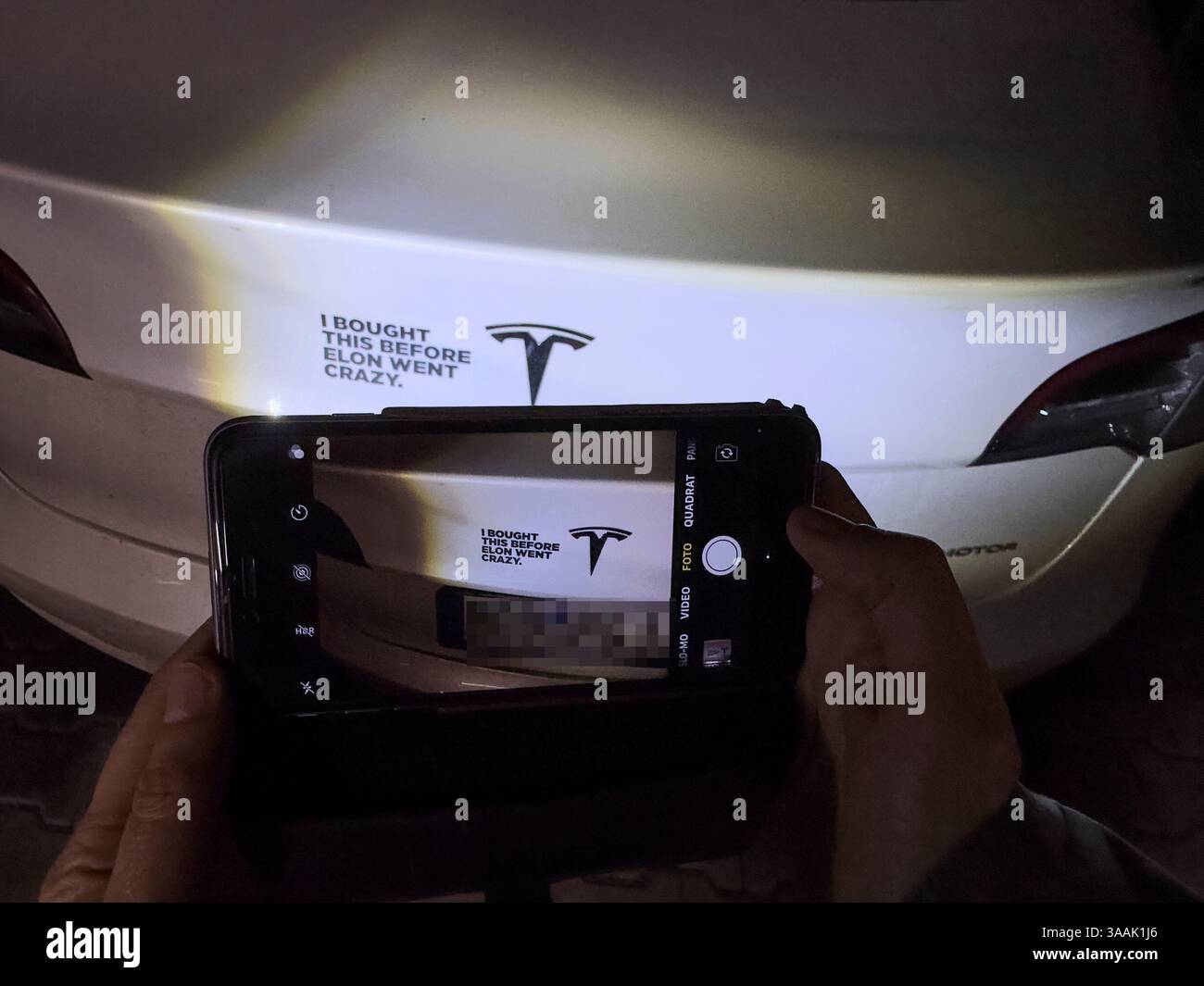 Marktoberdorf, Germany. 31st Mar, 2025. Tesla sticker „ I bought this ...