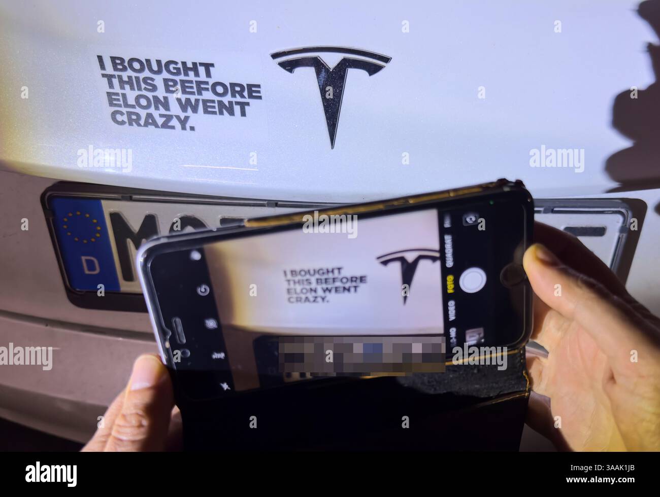 Tesla sticker „ I bought this before Elon went crazy“ on a Tesla car ...