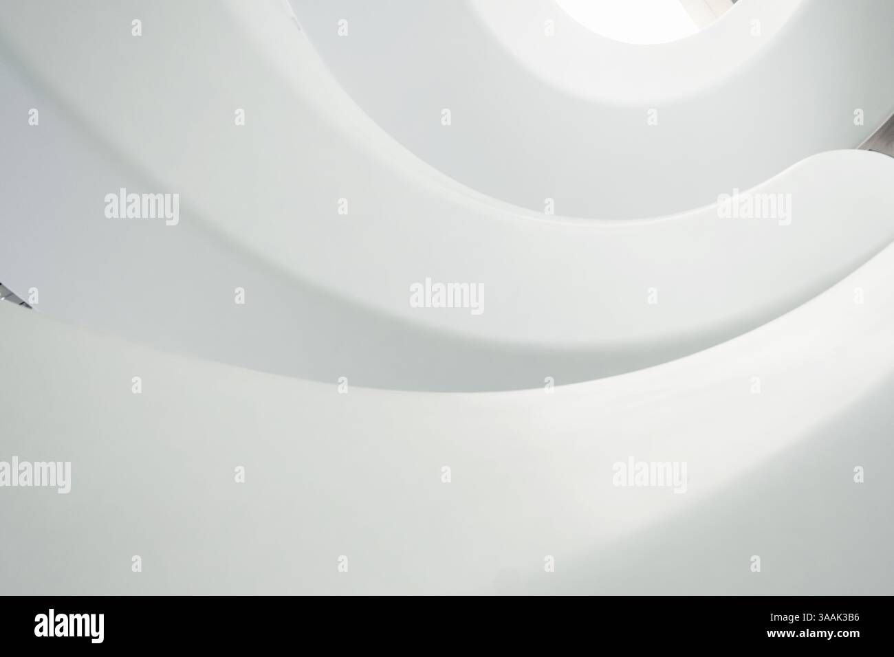 Abstract view of white spiral staircase with smooth curves and ...