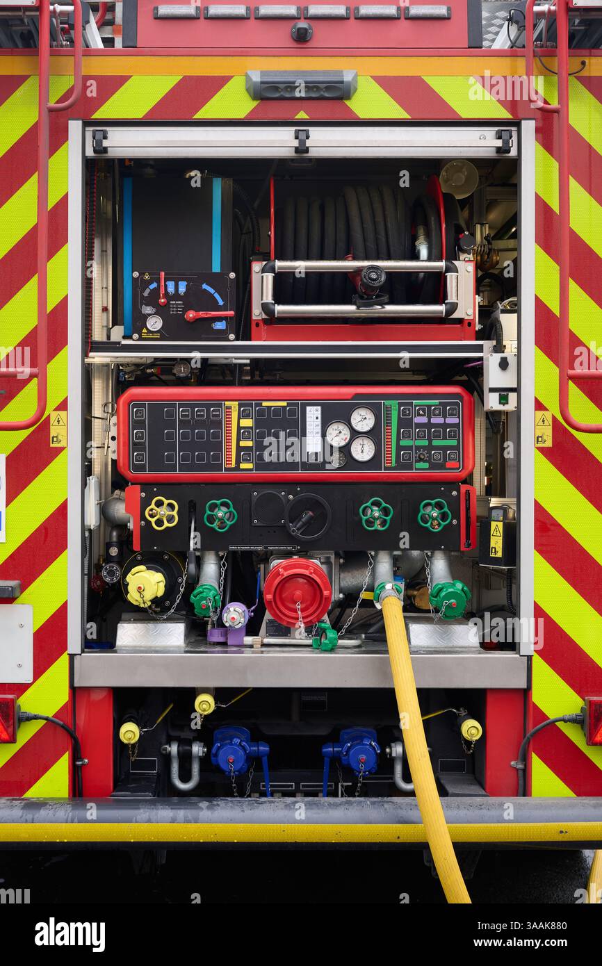view of the water pump system on the back of a fire truck. The panel ...