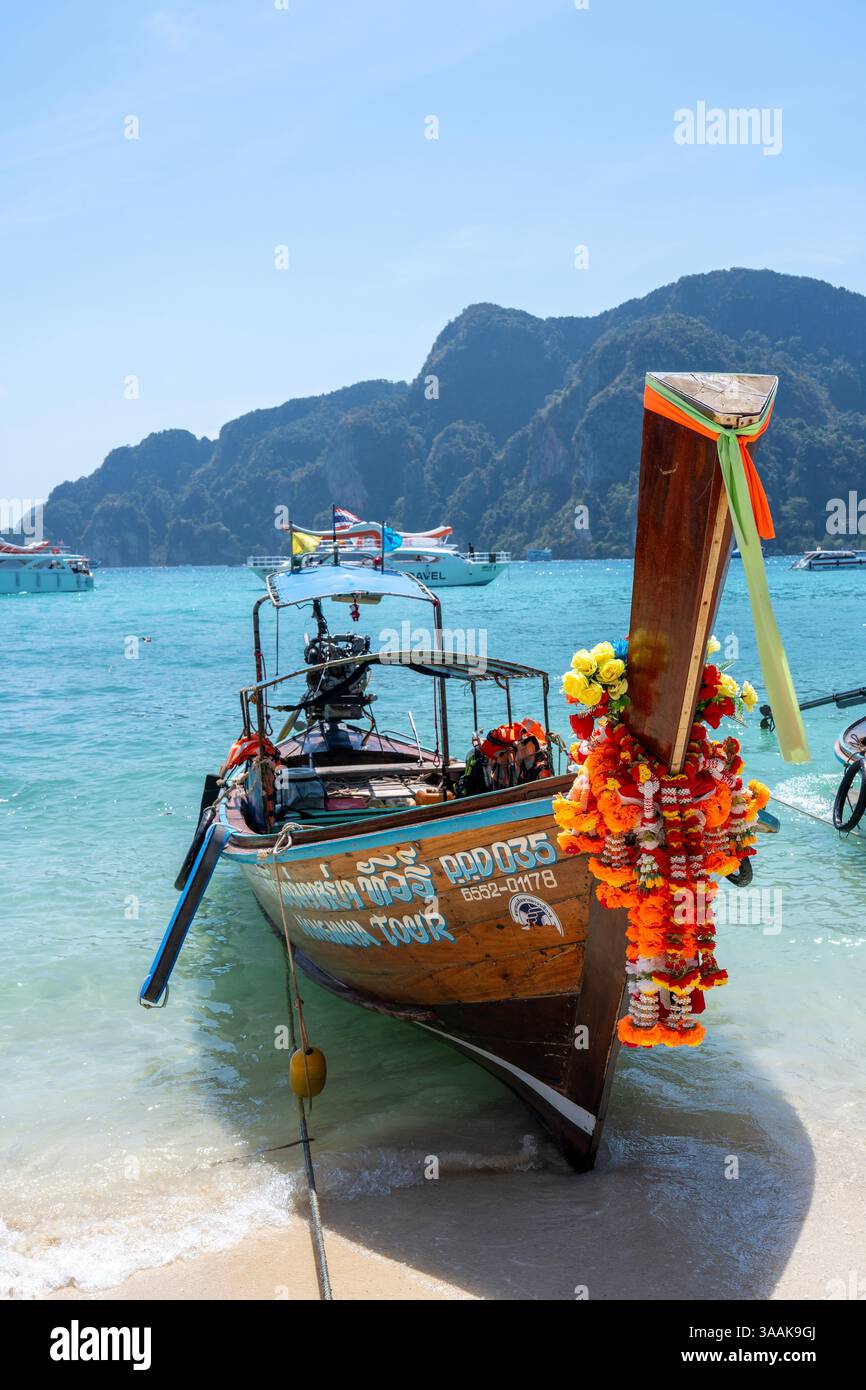 Long-tailed boat are moored on beach of Ko Phi Phi Don island, Ao Nang ...