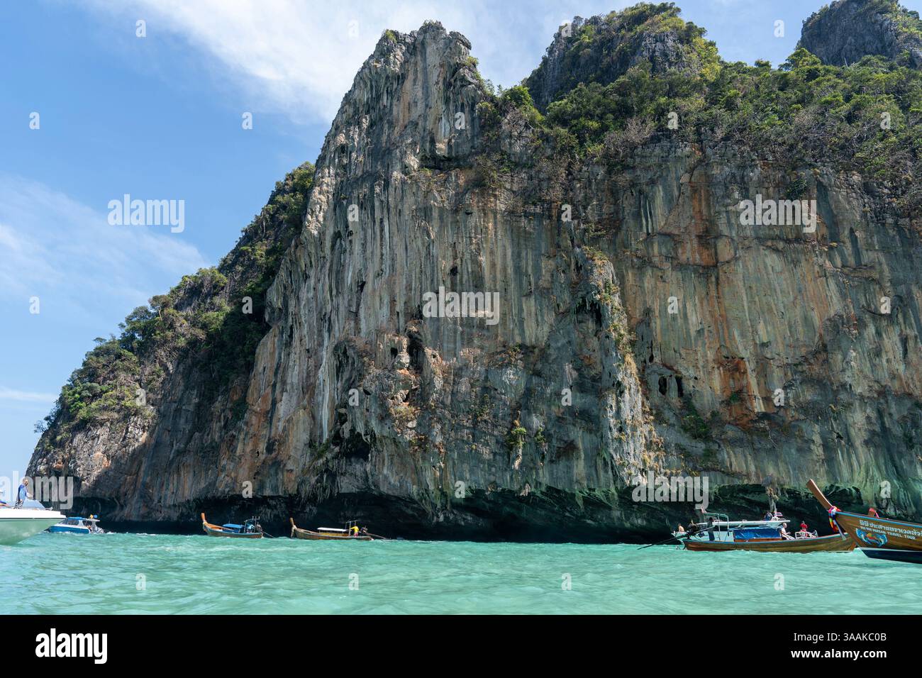 Traditional Thai long-tail boats and ships in Pileh lagoon of Ko Phi Phi Leh island in the ...