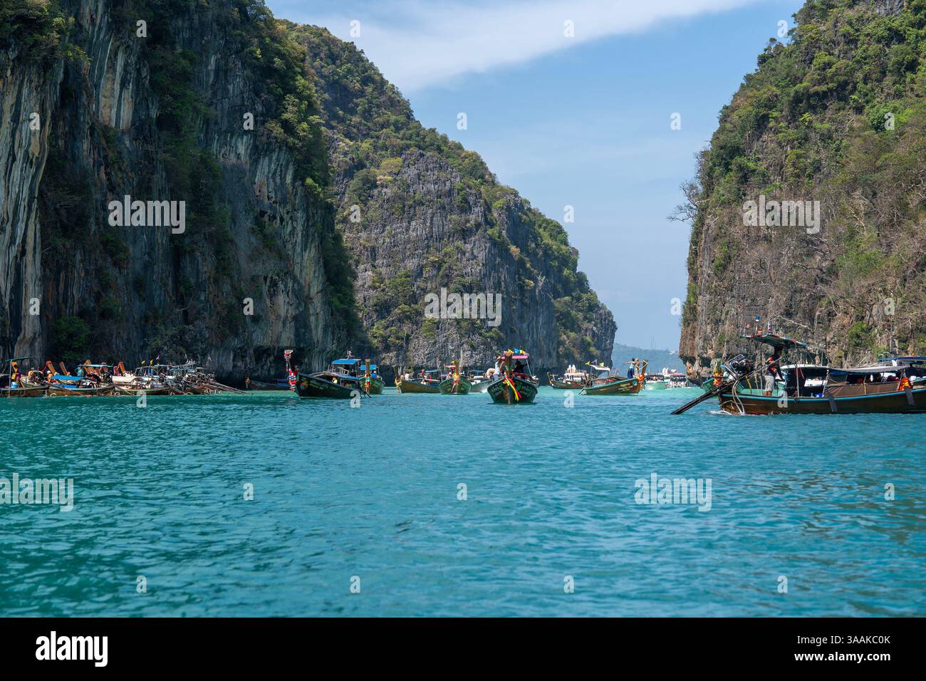 Traditional Thai long-tail boats and ships in Pileh lagoon of Ko Phi Phi Leh island in the ...