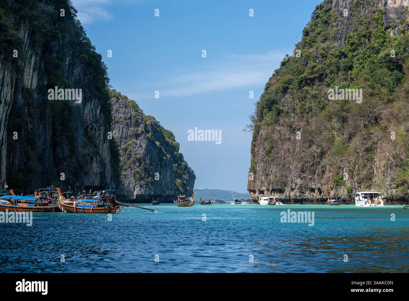 Traditional Thai long-tail boats and ships in Pileh lagoon of Ko Phi Phi Leh island in the ...