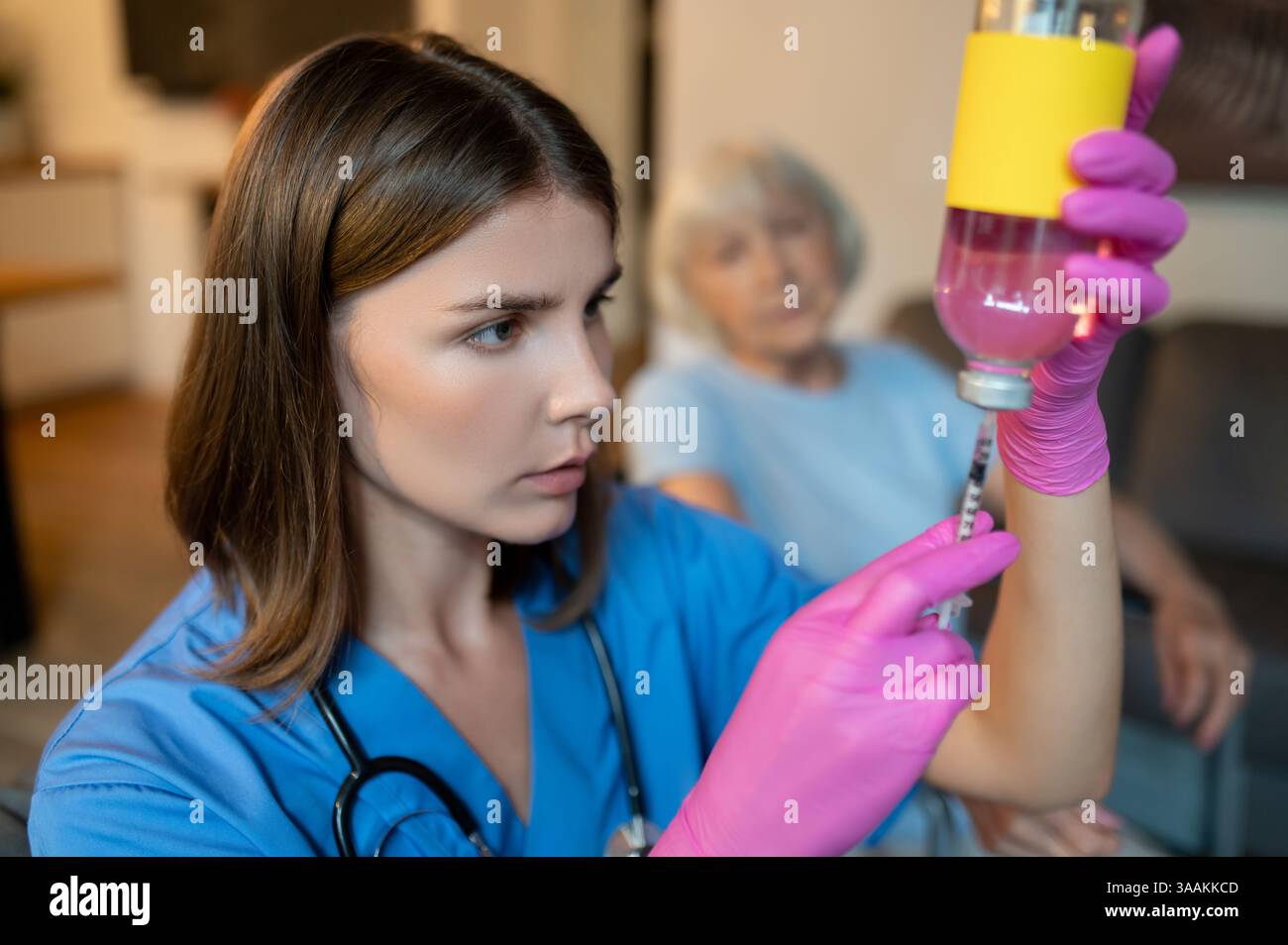 Doctor making treatment and intravenous infusion with medication to ...