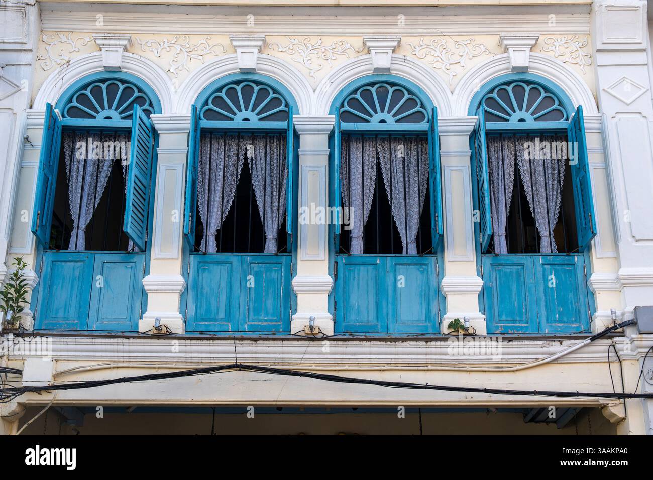 Colorful facades of Portuguese style buildings on streets of Phuket Old ...