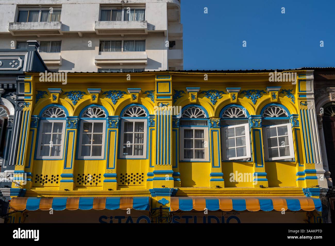 Colorful facades of Portuguese style buildings on streets of Phuket Old ...