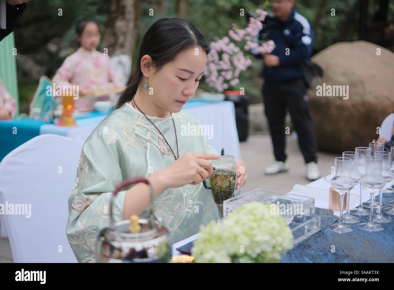 People experience picking tea leaves at a tea garden in Nantong City ...