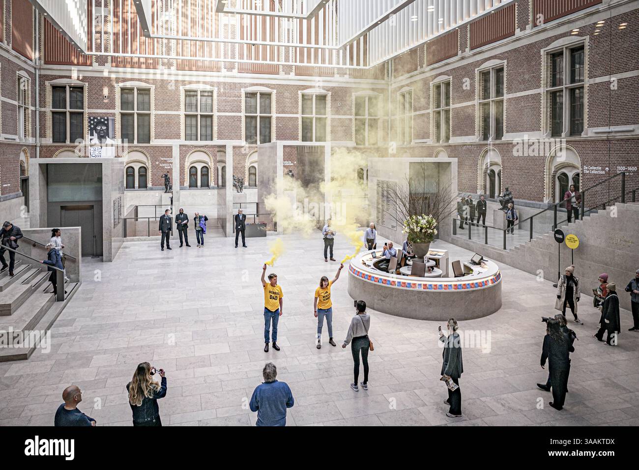 AMSTERDAM - Activists light torches in the hall of the Rijksmuseum ...