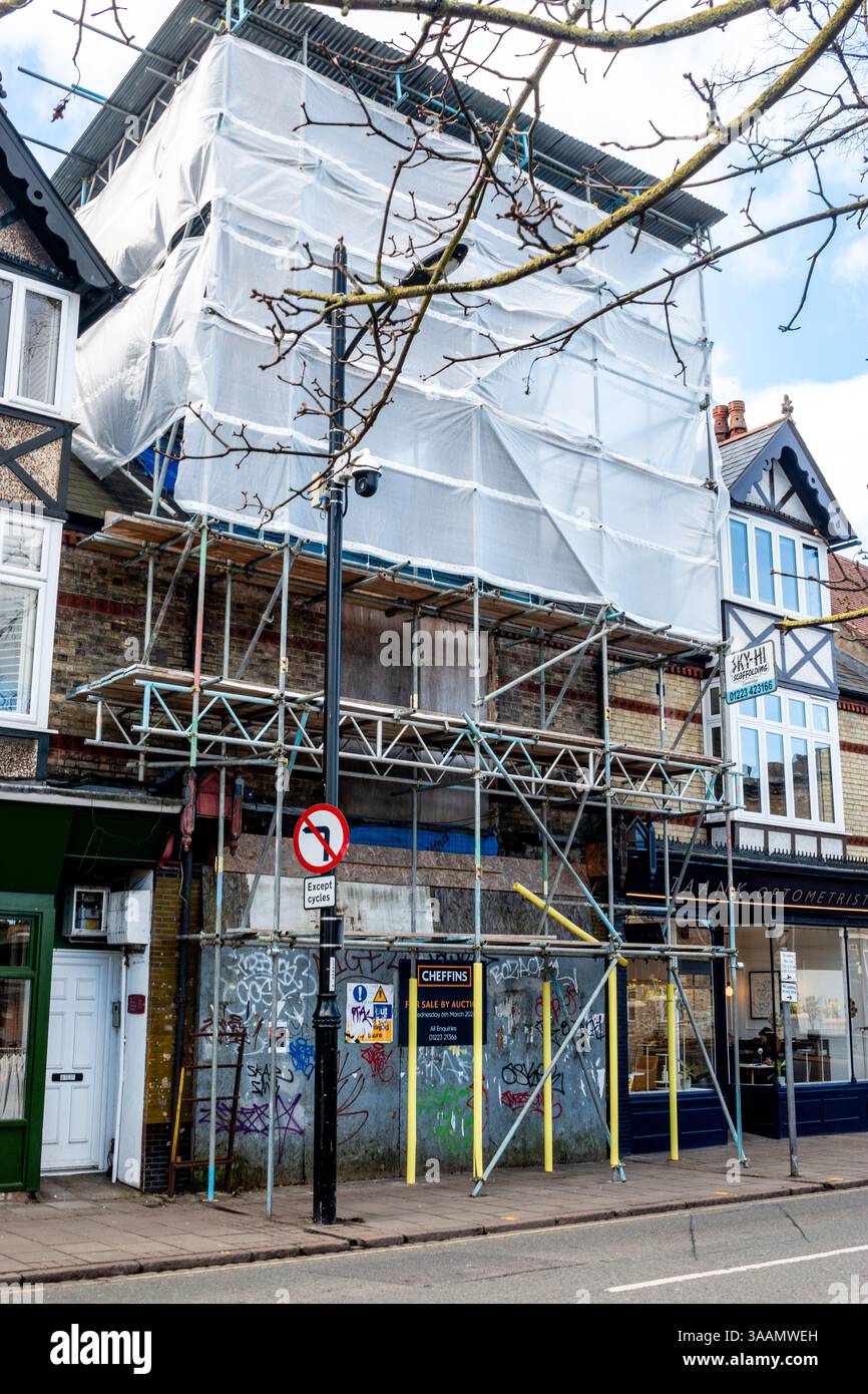 The burnt shell of Mr Gee's electrical shop covered in scaffolding and ...