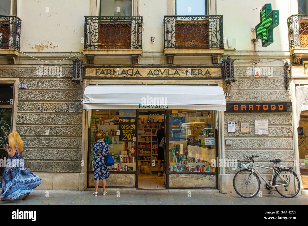 Udine, Italy - July 9th 2024. An historic pharmacy in the centre of ...