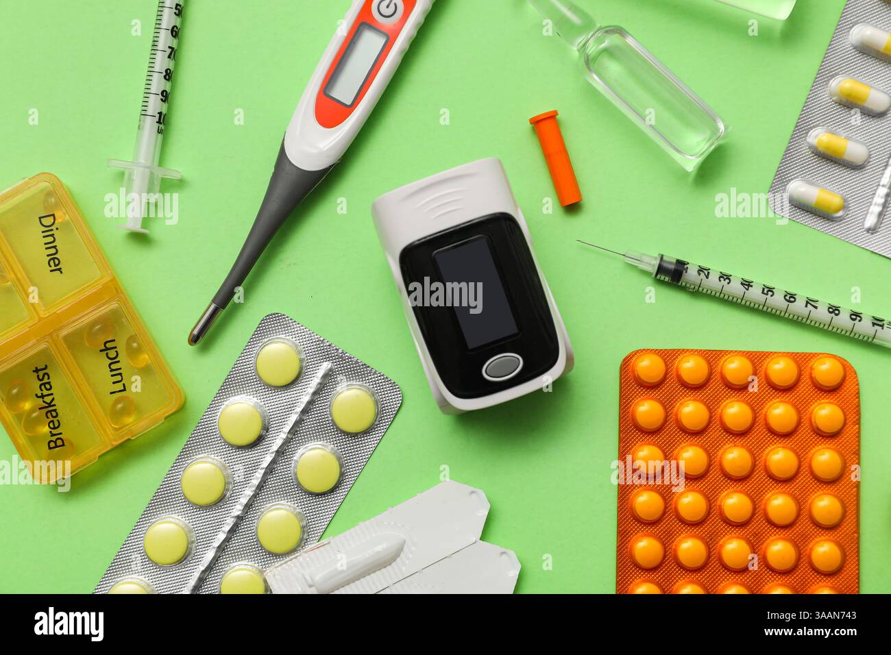 Pulse oximeter, blister packs of pills, ampule, thermometer, pill box ...