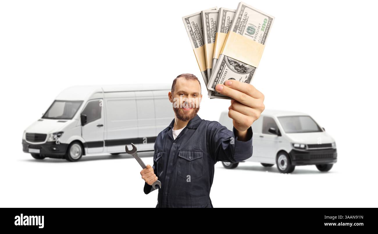 Van mechanic in a uniform holding a wrench and money isolated on white ...