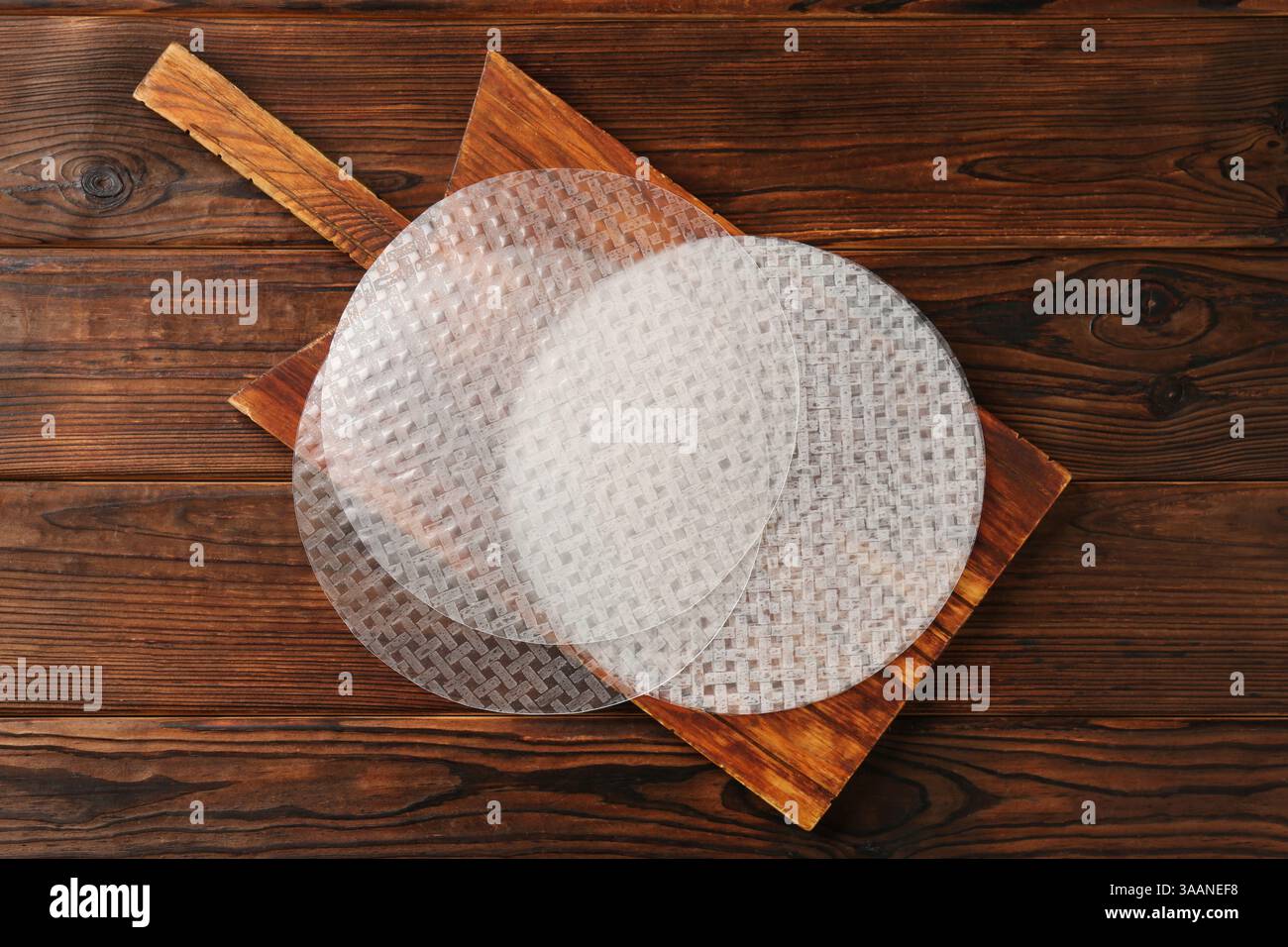 Edible rice paper sheets on wooden table, top view Stock Photo - Alamy