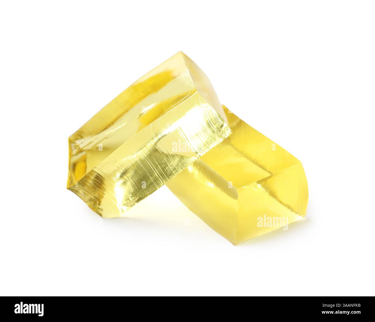Tasty yellow jelly cubes isolated on white Stock Photo - Alamy