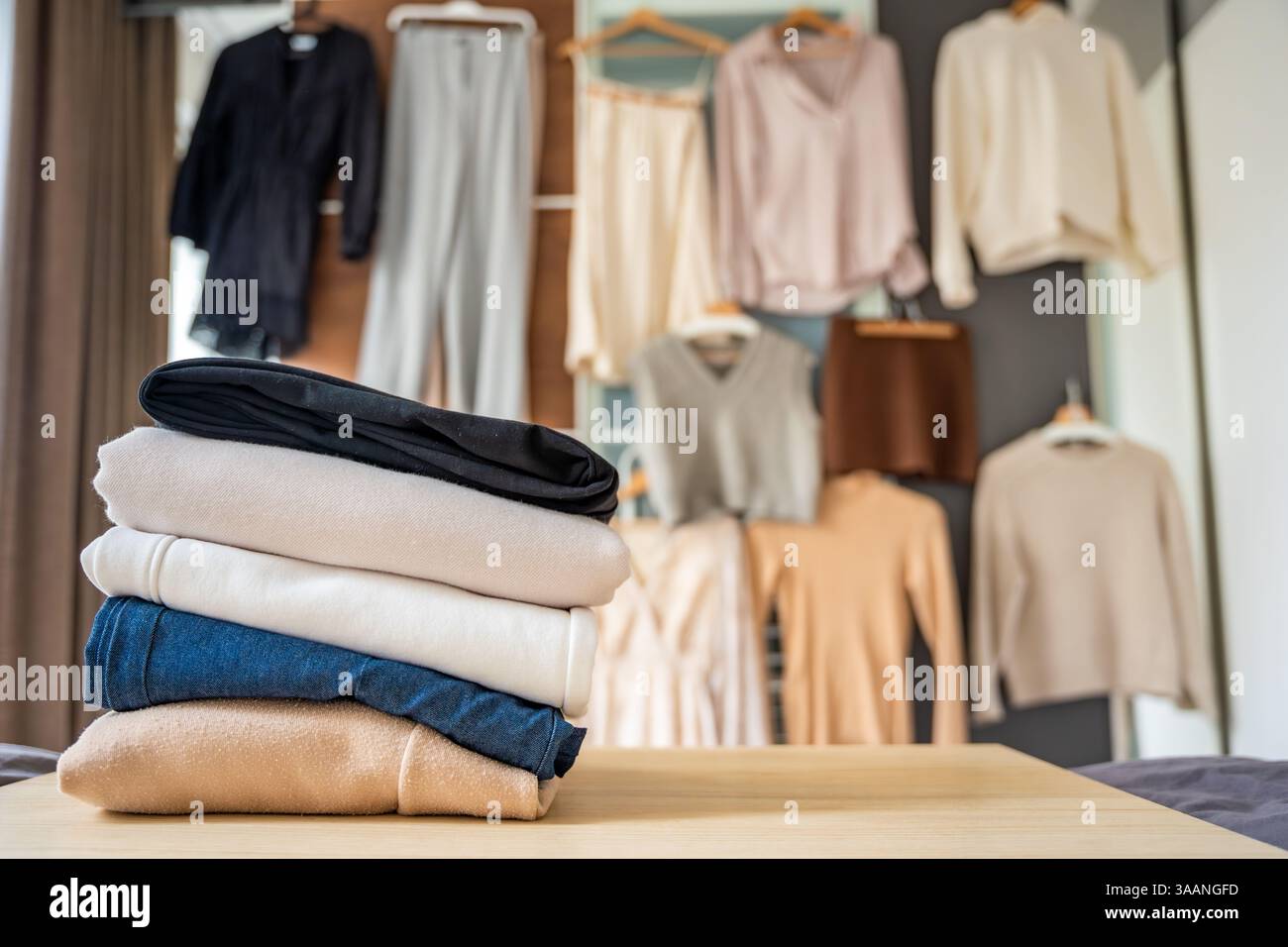 Stacked pile of clothing prepared for resale, donation, or recycling ...