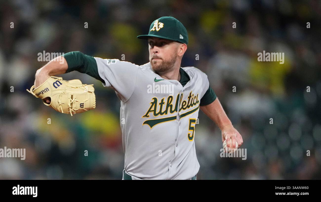 Athletics starting pitcher Jeffrey Springs throws against the Seattle ...
