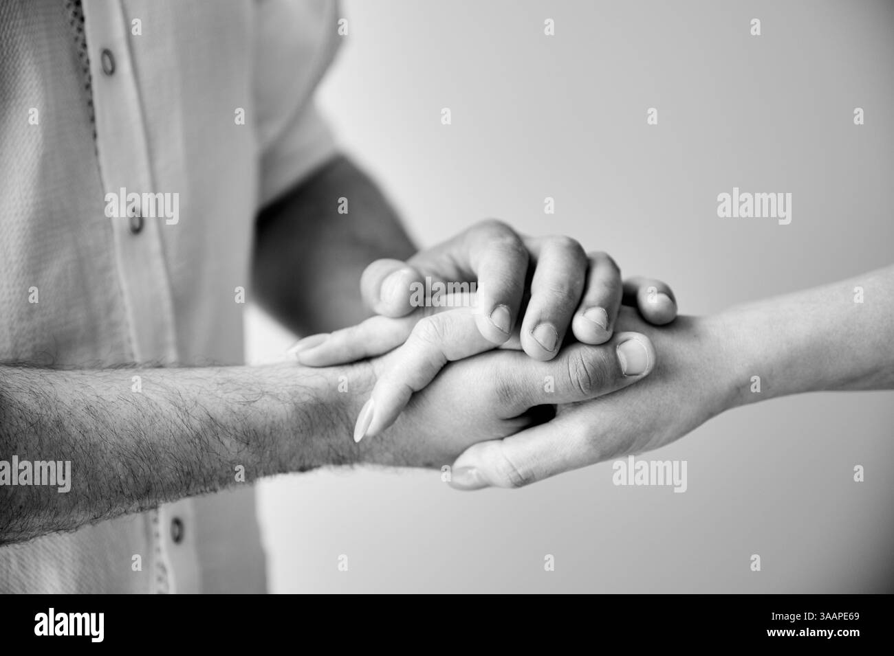 Close up of two hands engaging in delicate touch. Man's and woman's ...