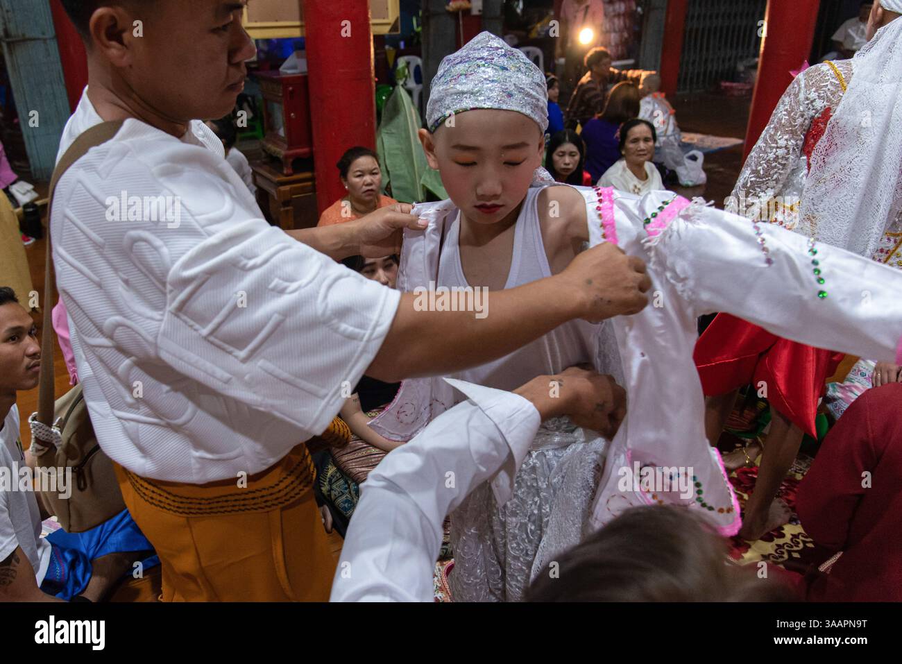 A young ethnic Shan boy seen dressing in the early morning during the ...