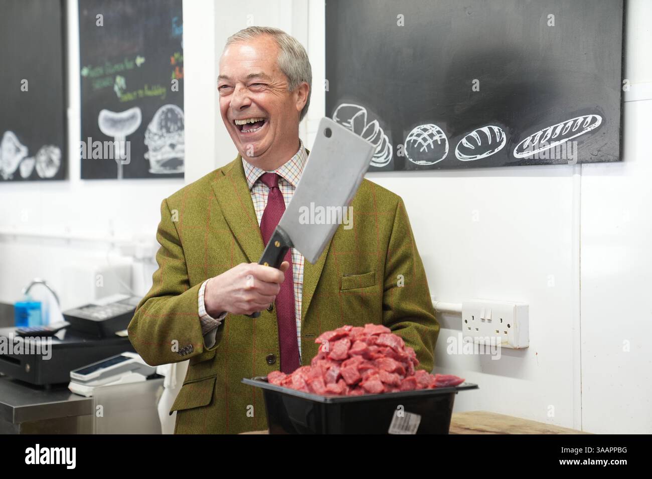 Reform UK leader Nigel Farage visits a butcher's shop during Reform UK ...