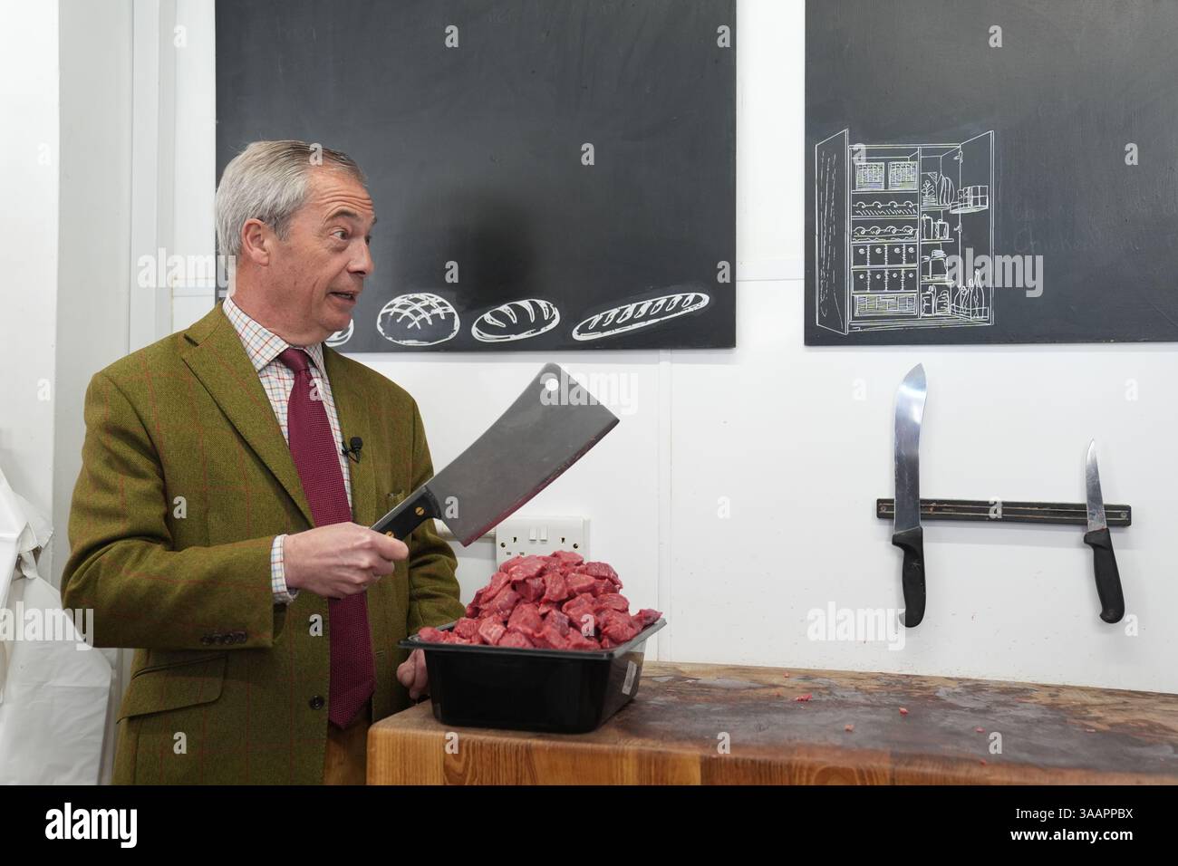 Reform UK leader Nigel Farage visits a butcher's shop during Reform UK ...