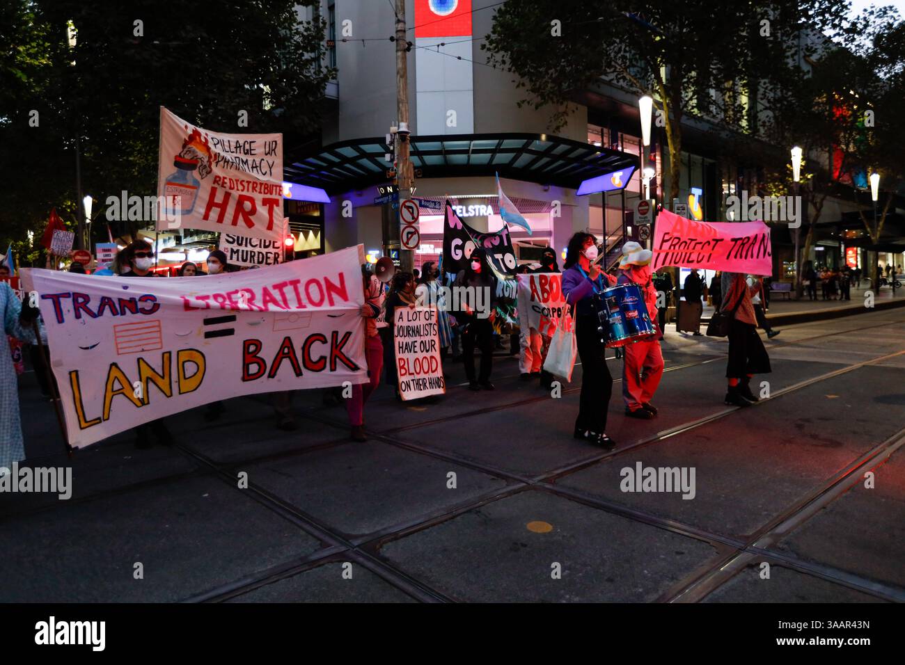 Protesters march on the streets holding banners during the rally. The ...