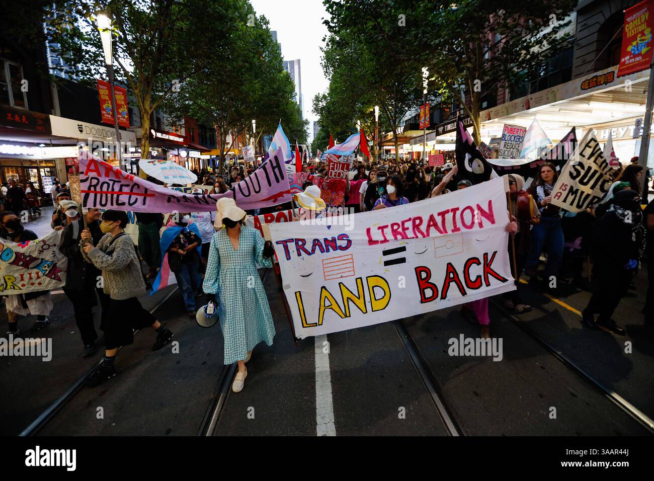 Protesters march on the streets holding banners during the rally. The ...