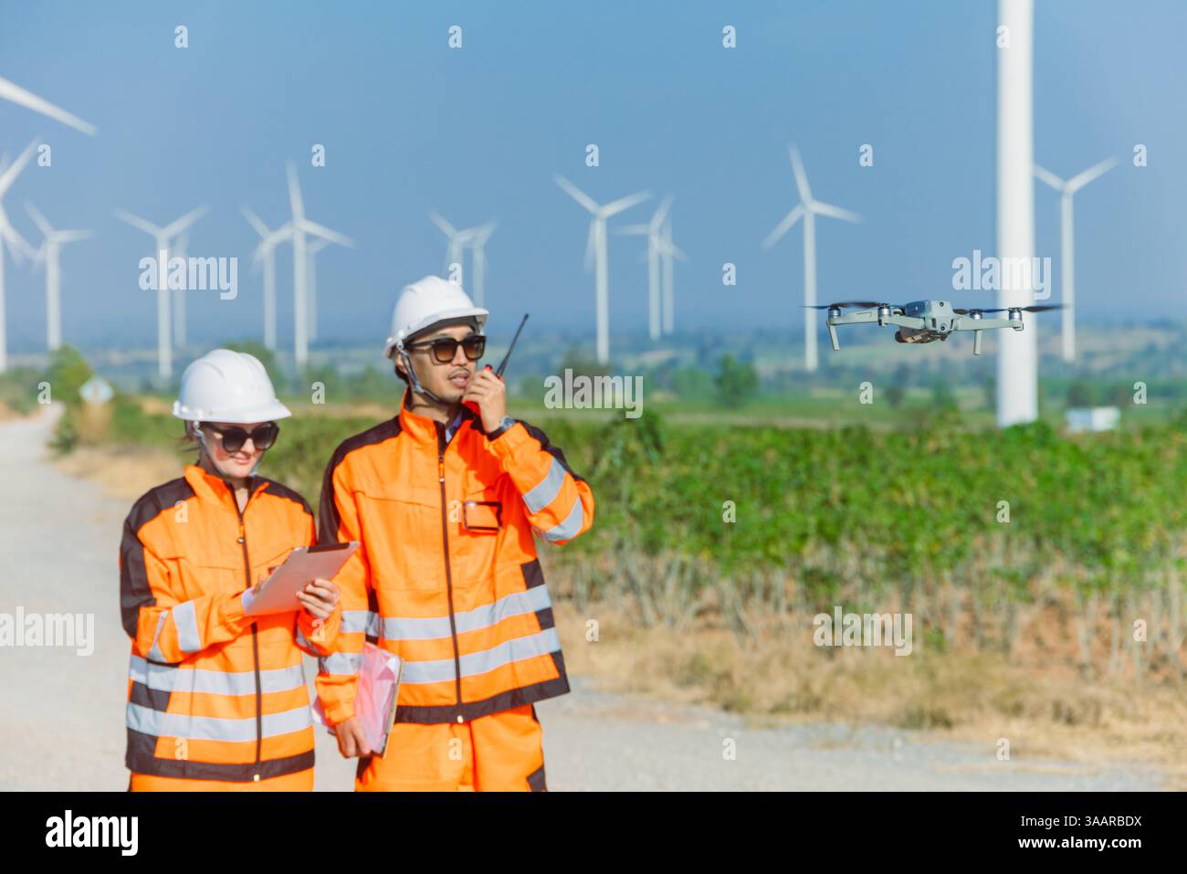 Engineer team using UAV Drone technology device to fly survey service ...