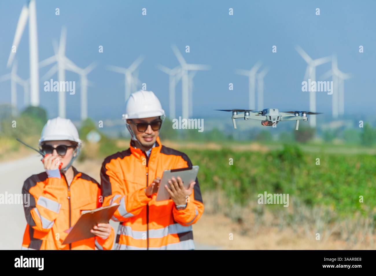 Engineer team using UAV Drone technology device to fly survey service ...
