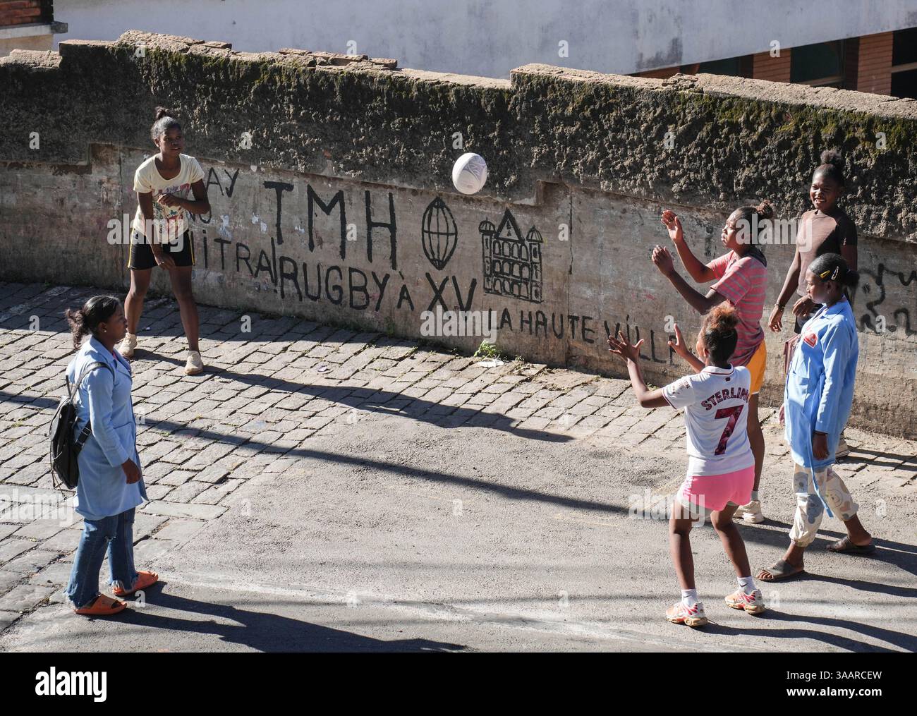 Antananarivo, Madagascar. 26th Mar, 2025. Children play a ball in ...