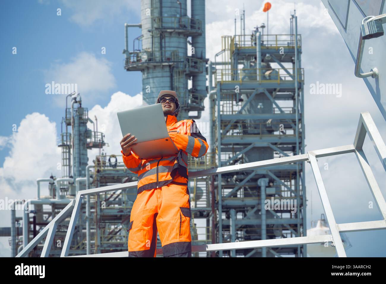 Professional Oil and Gas Petroleum Refinery worker on duty at crude oil ...