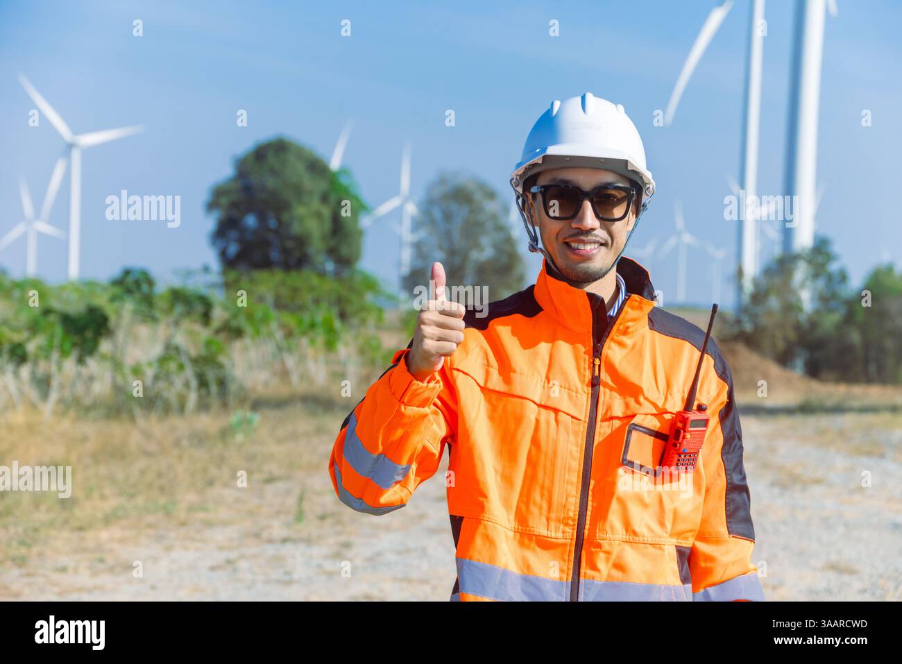 Portrait Asian Japanese engineer worker standing hand thumbs up at wind ...