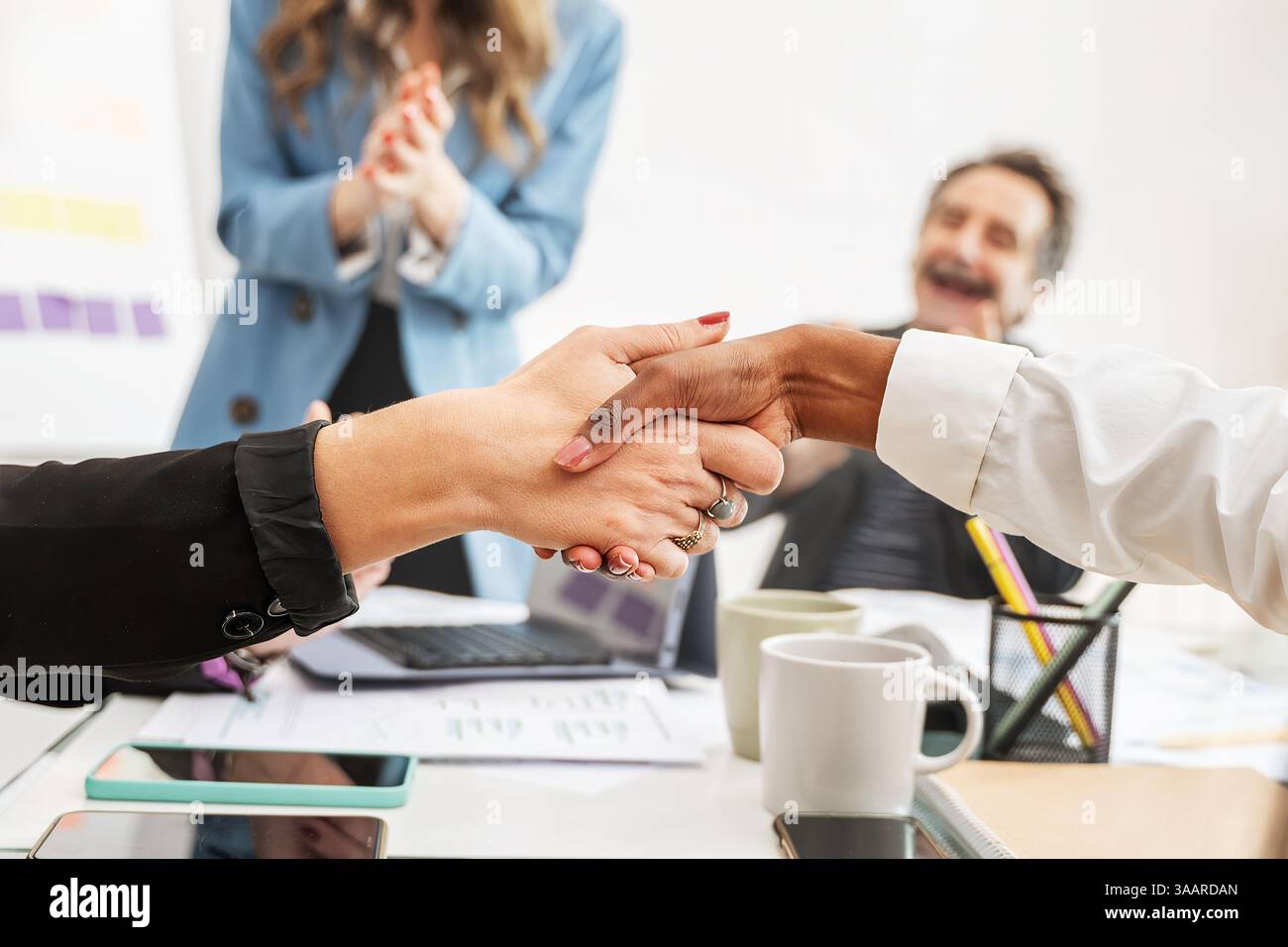 Handshake between diverse businesspeople hi-res stock photography and ...