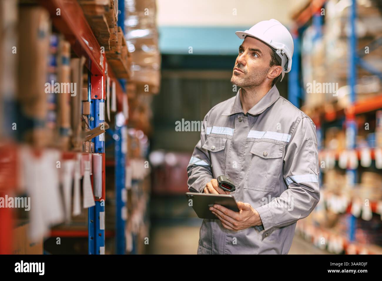 Warehouse worker working check inventory at shelf with barcode scan ...