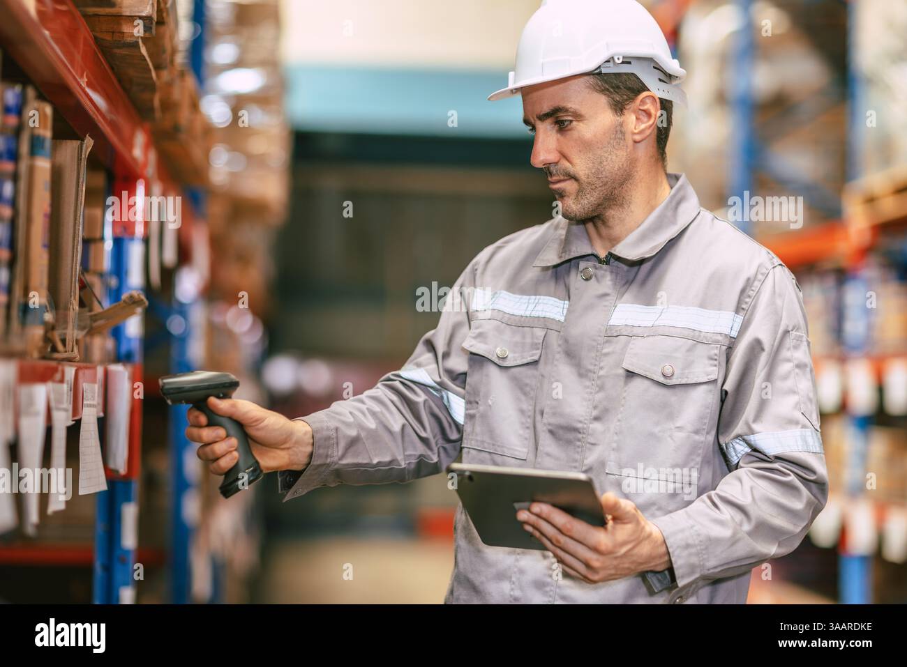 Warehouse worker working check inventory at shelf with barcode scan ...