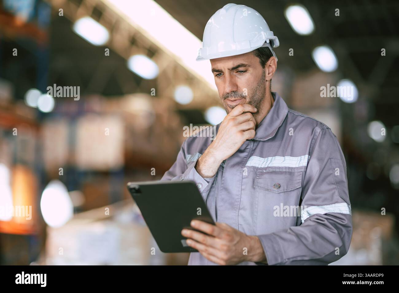 Warehouse worker, Engineer manager looking at tablet screen with ...