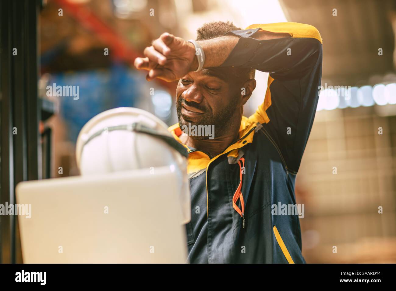 African black male worker tired stressed sweat from hot weather in ...
