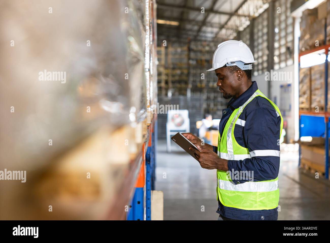 african black professional warehouse worker. stock inventory staff ...