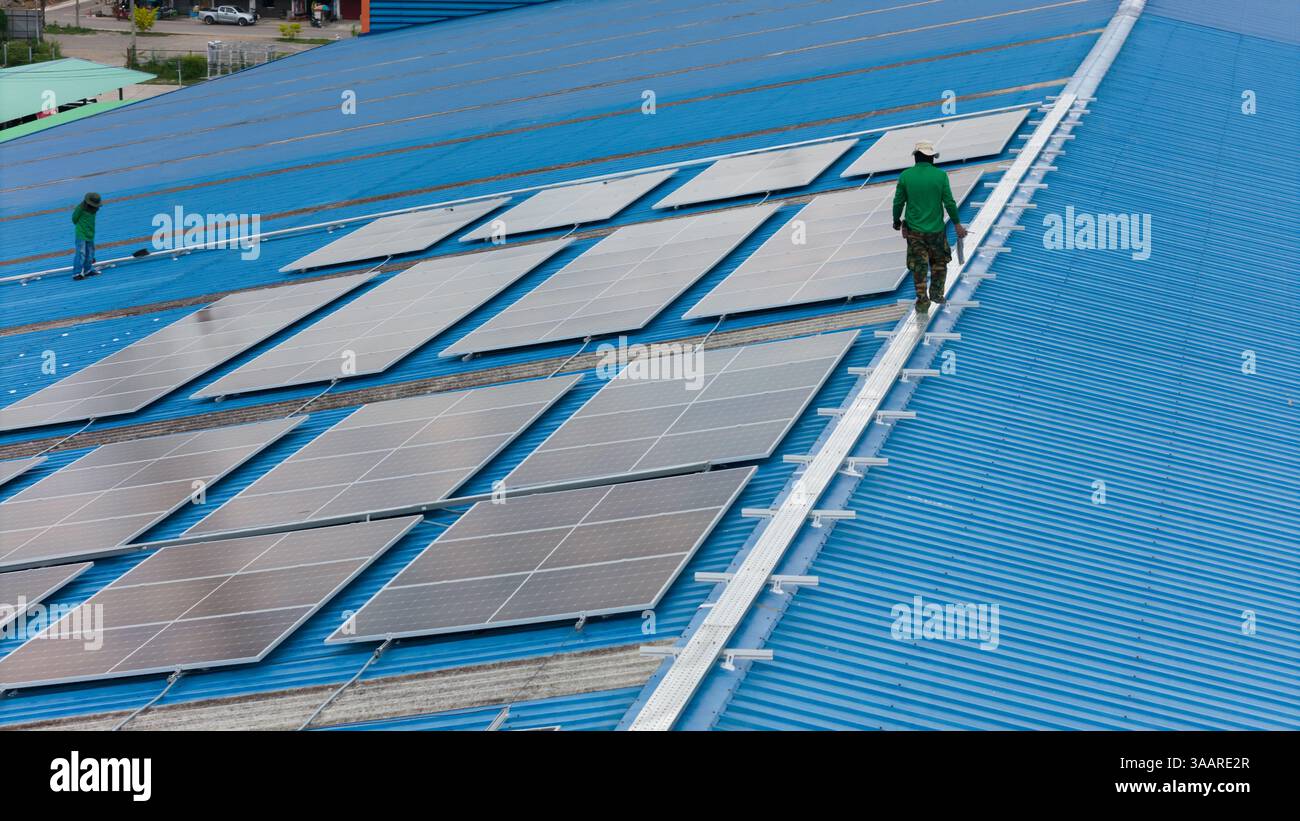 Aerial view of Professional Engineer Team Service Solar Panel. Worker ...
