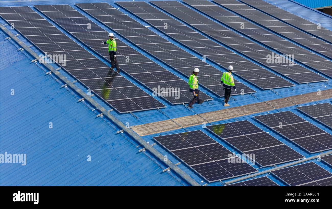 Aerial view of Professional Engineer Team Service Solar Panel. Worker ...