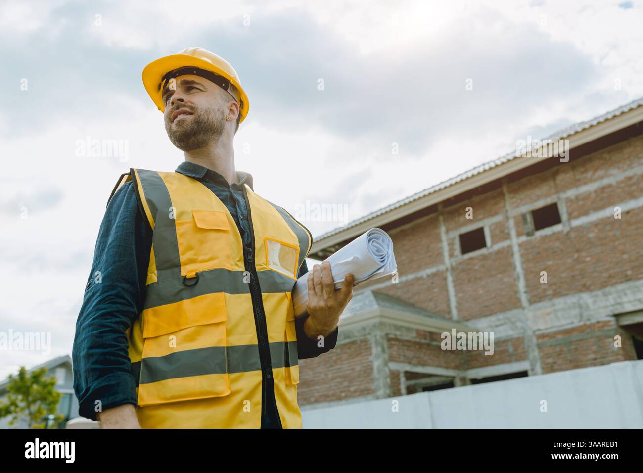 Construction worker happy smile, Caucasian engineer male standing wearing safety vest and helmet ...