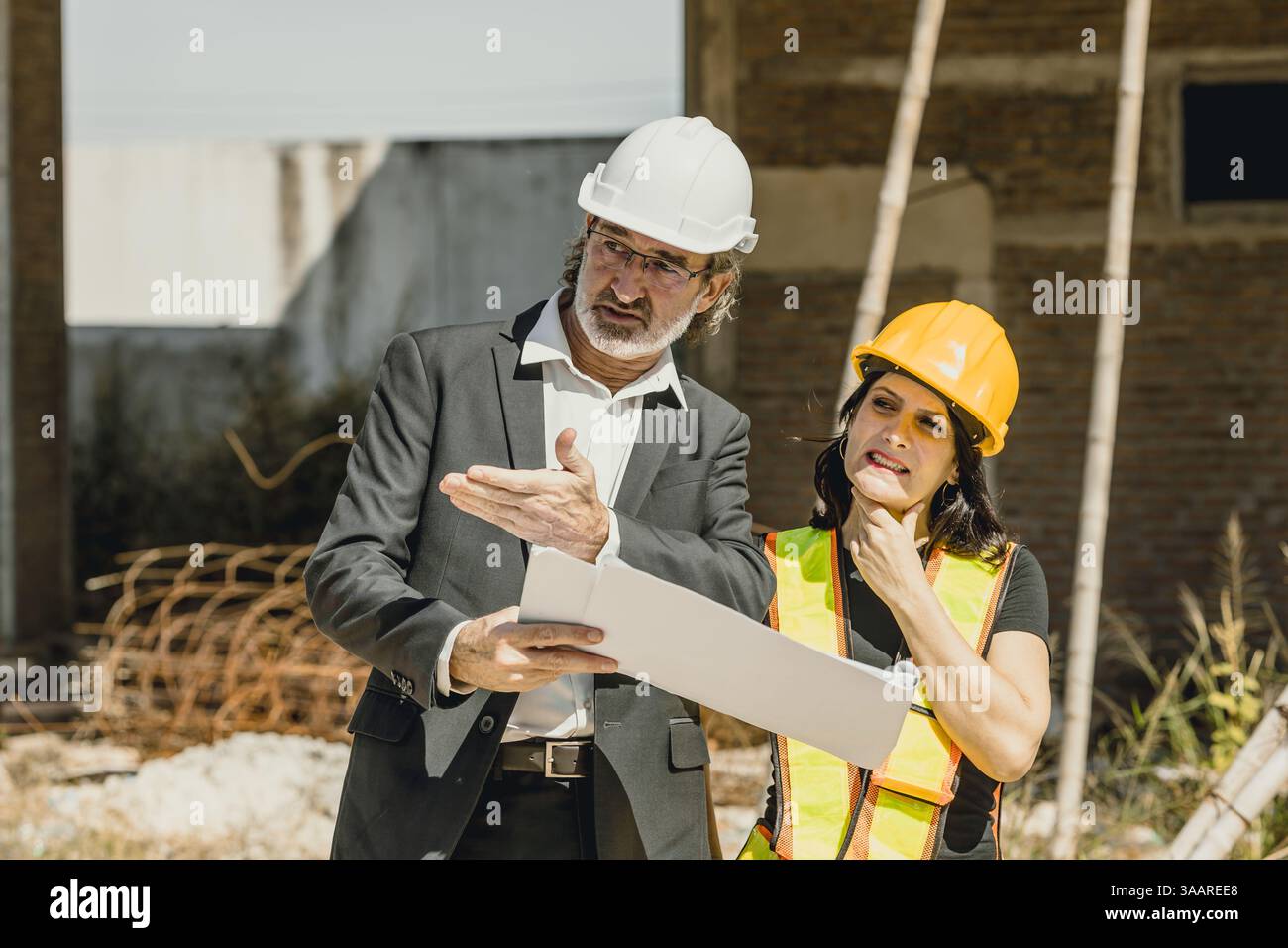 Senior Professional Construction manager talking working guide to women ...